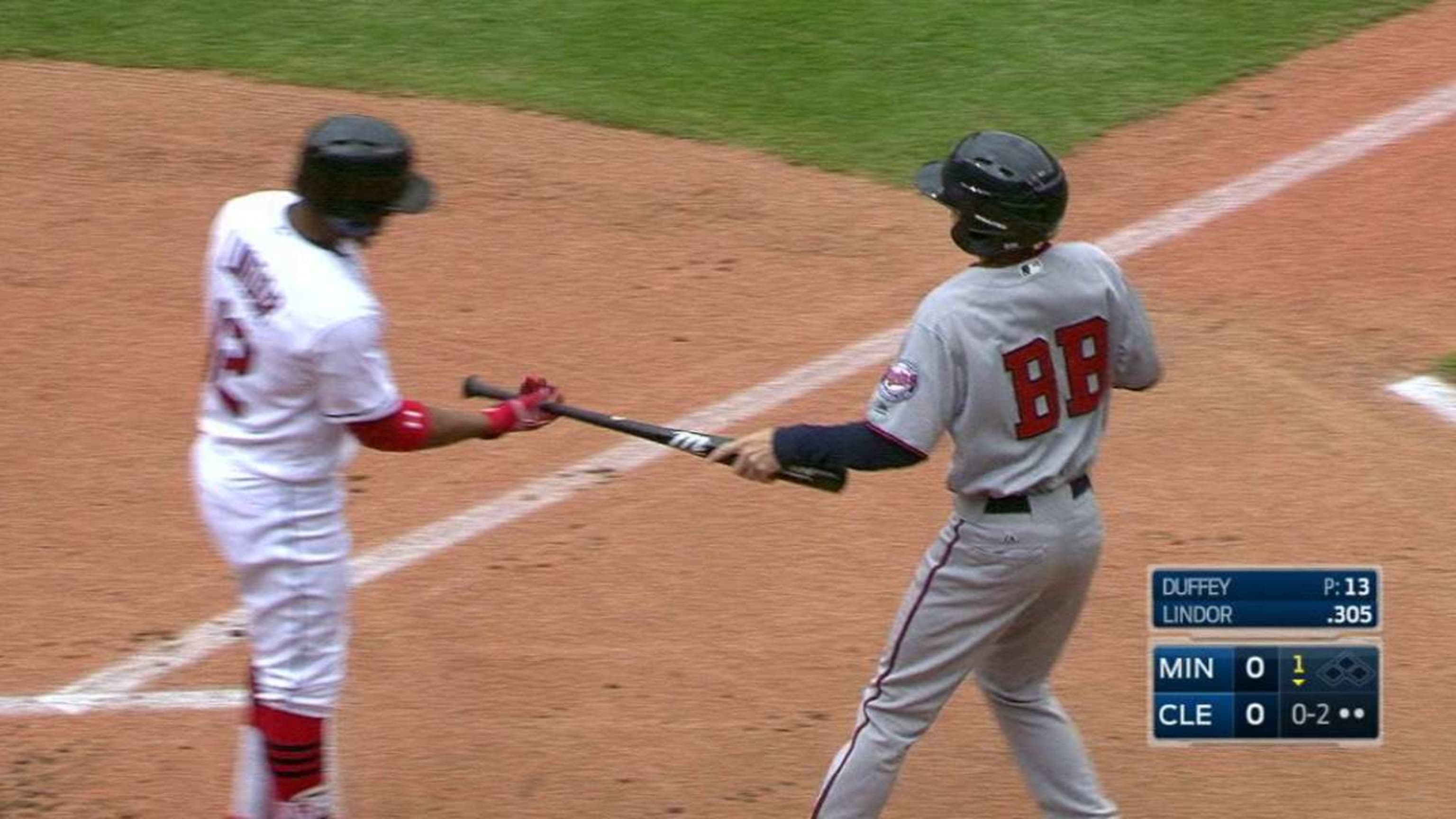 catches baseball bat