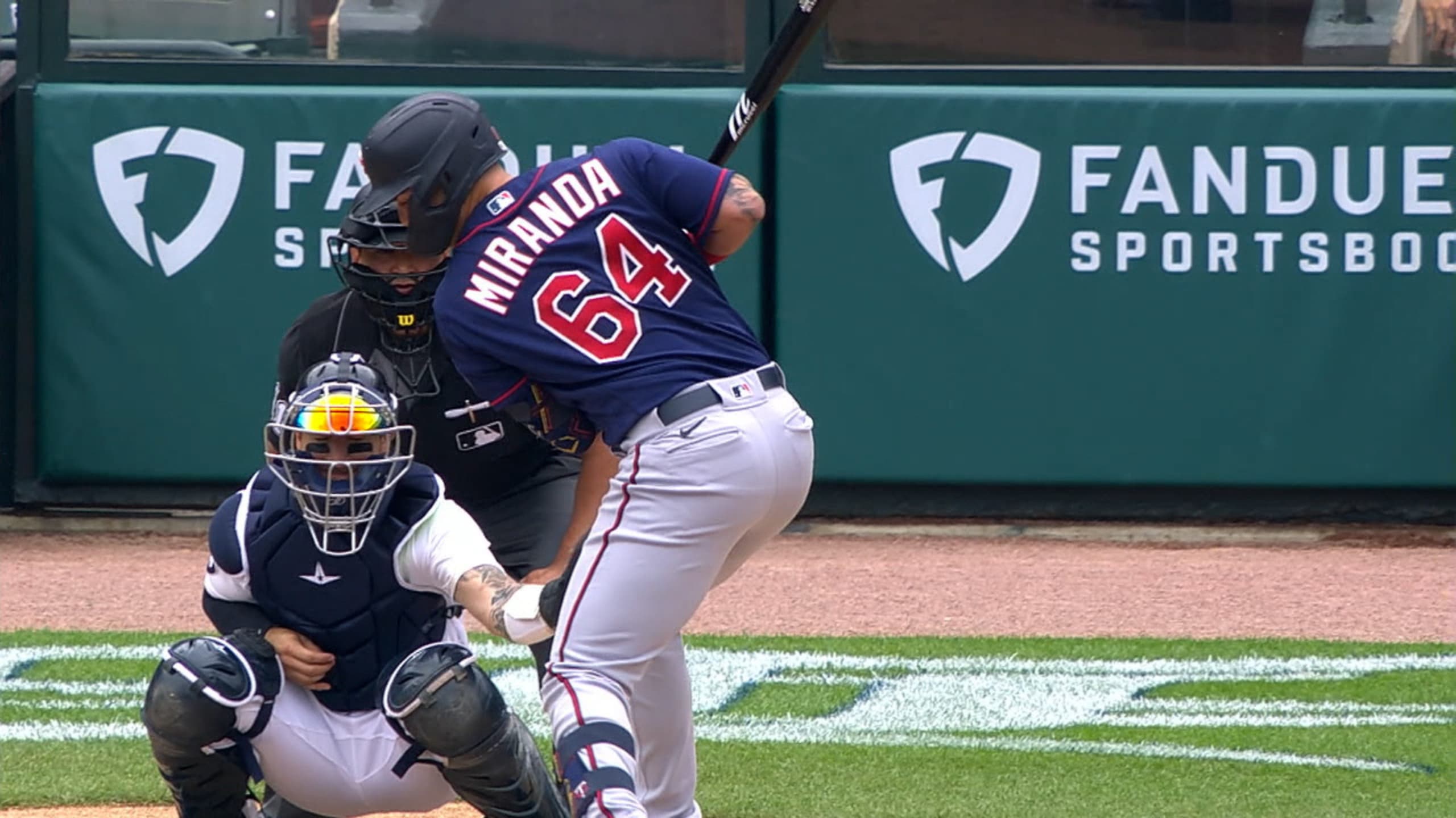 Jose Miranda gets hit by a pitch