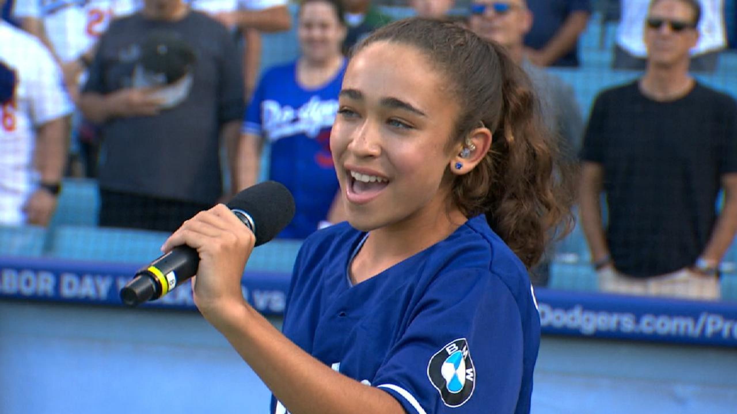 Emme Roberts sings anthem