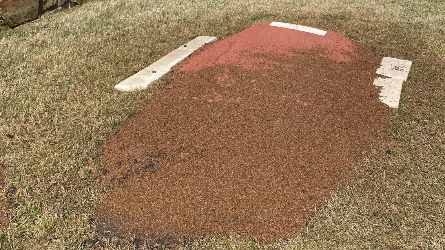 Jared Hughes builds mound in backyard