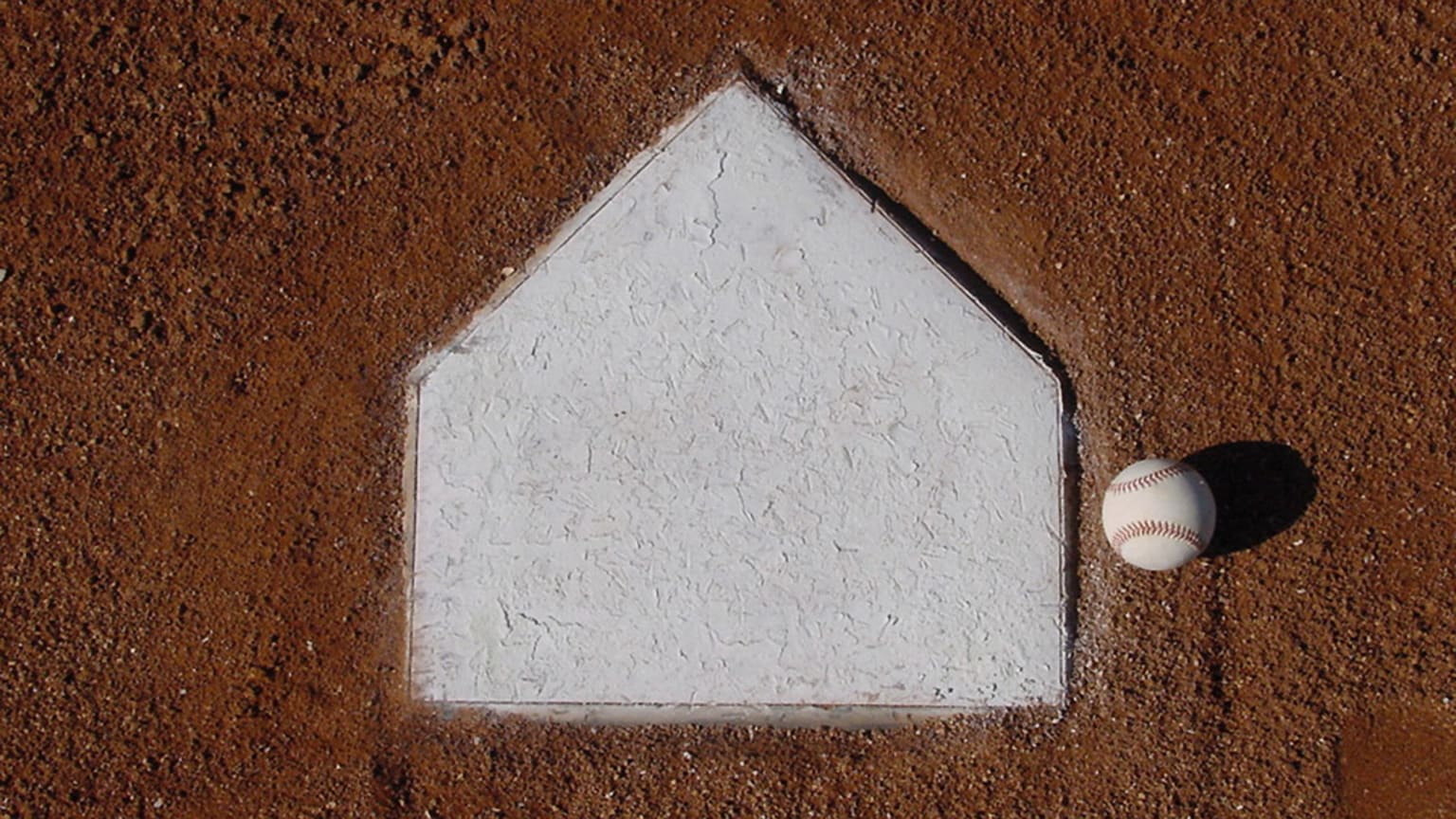 Why is home plate shaped different than other bases?