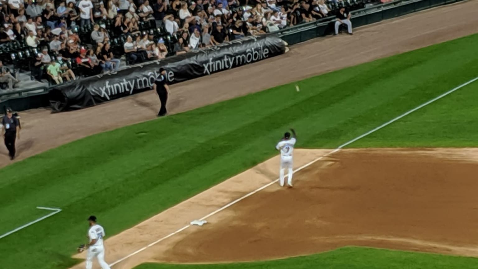 Tim Anderson interacting with fans through baseballs