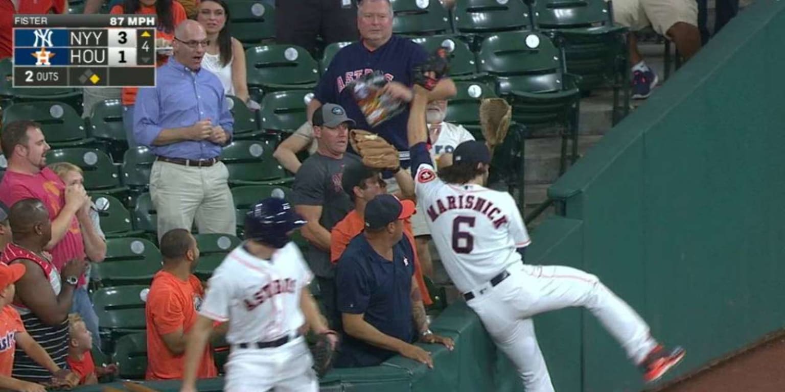 Focus, thy name is Jake Marisnick, unfazed by excited fans and the wall ...