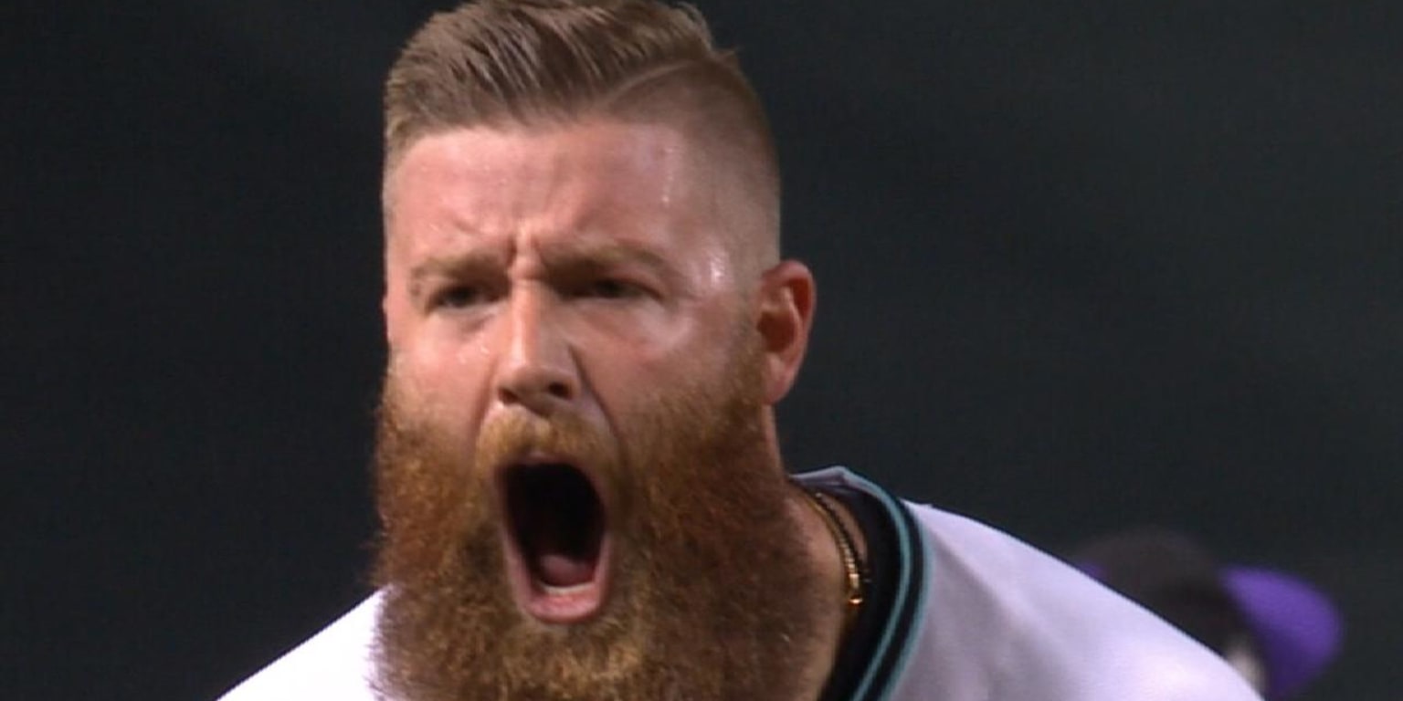 Archie Bradley let loose after hitting the first postseason triple by a ...