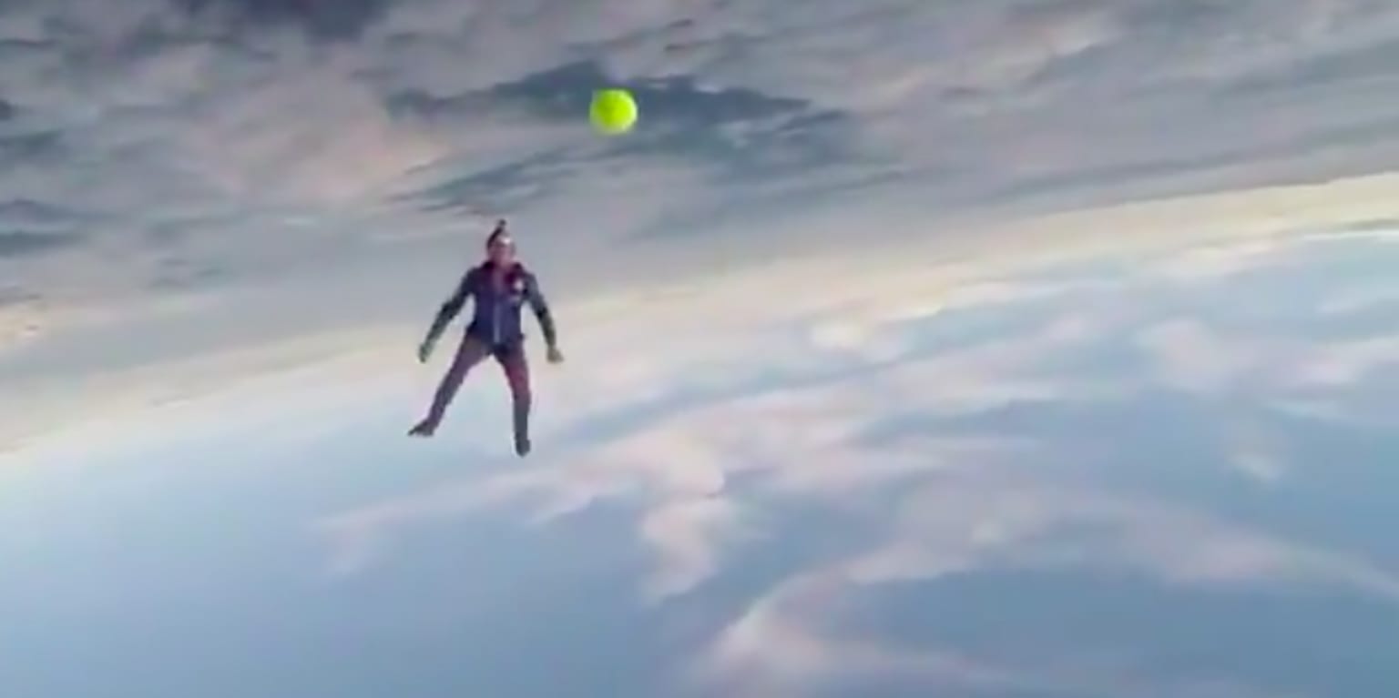 Playing catch while skydiving looks fun