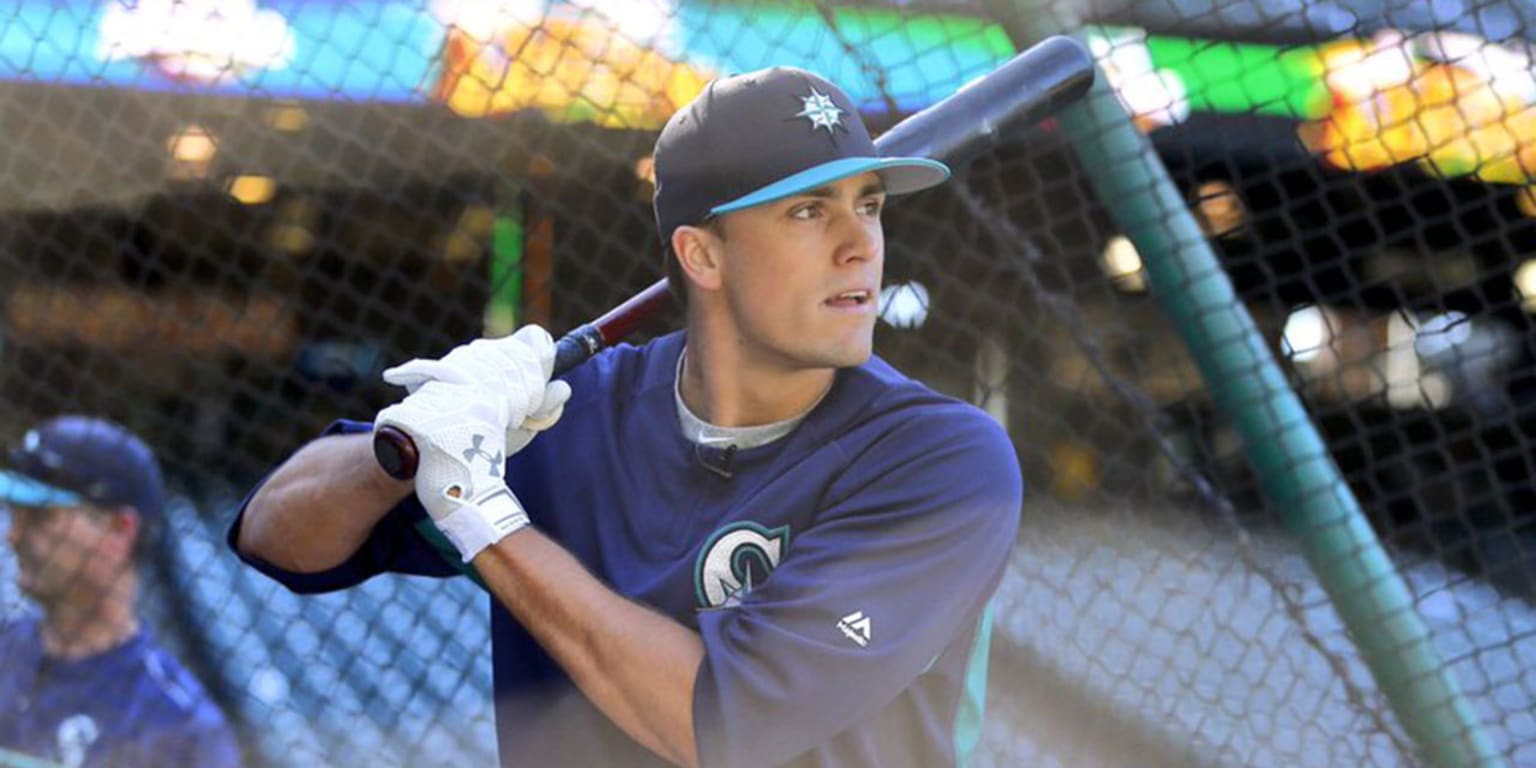 Evan White takes batting practice in Seattle