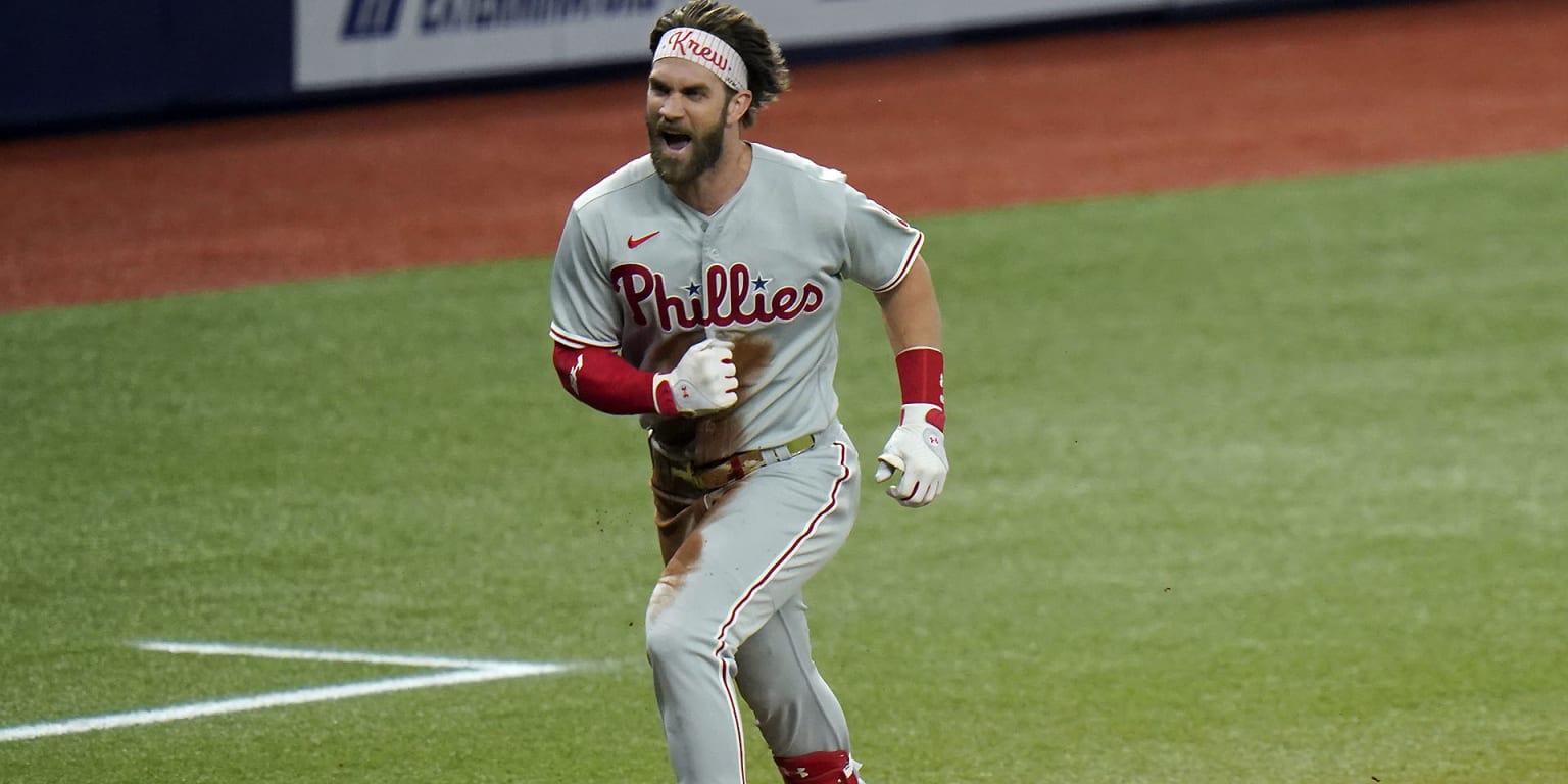 Bryce Harper rounds the bases on triple and error