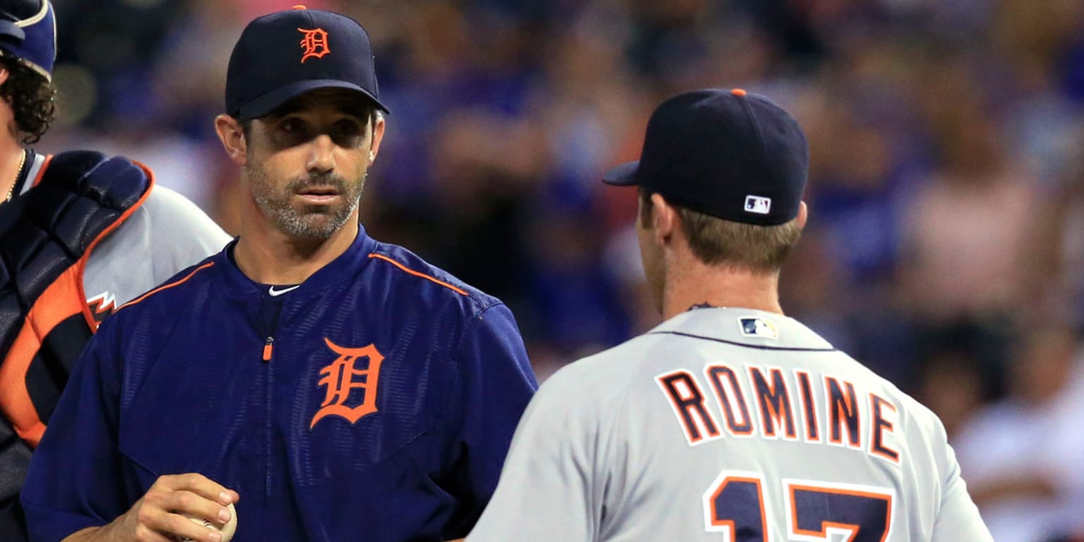 Tigers utility man Andrew Romine pitches