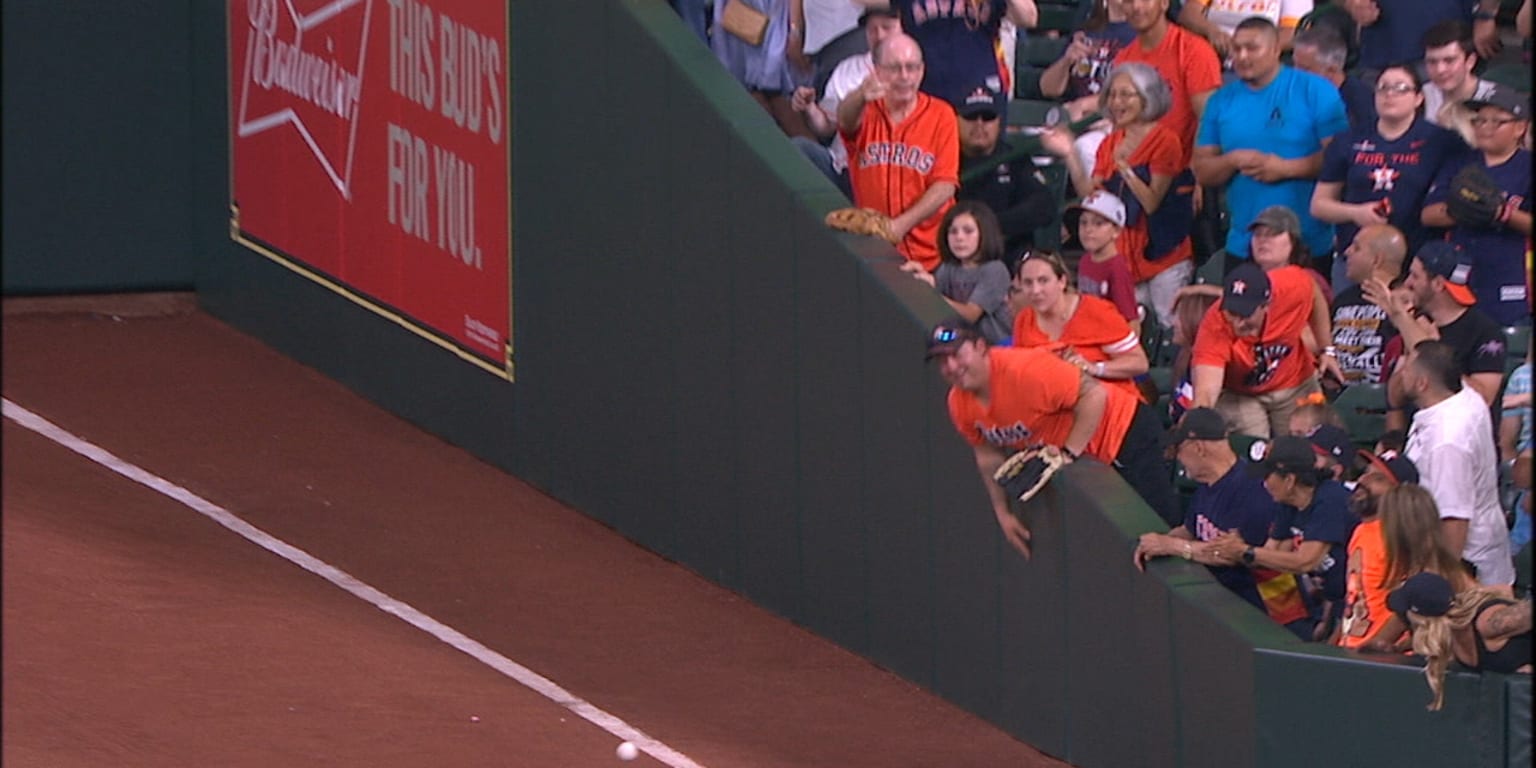 An Astros fan tried grabbing a live ball and his companion was not ...