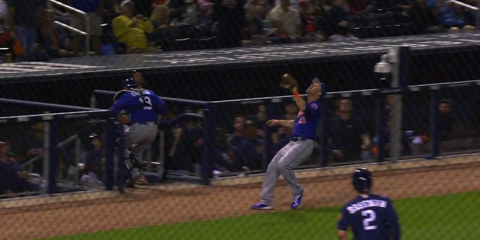 Travis d'Arnaud avoided a foul ball by running into the Astros' dugout ...