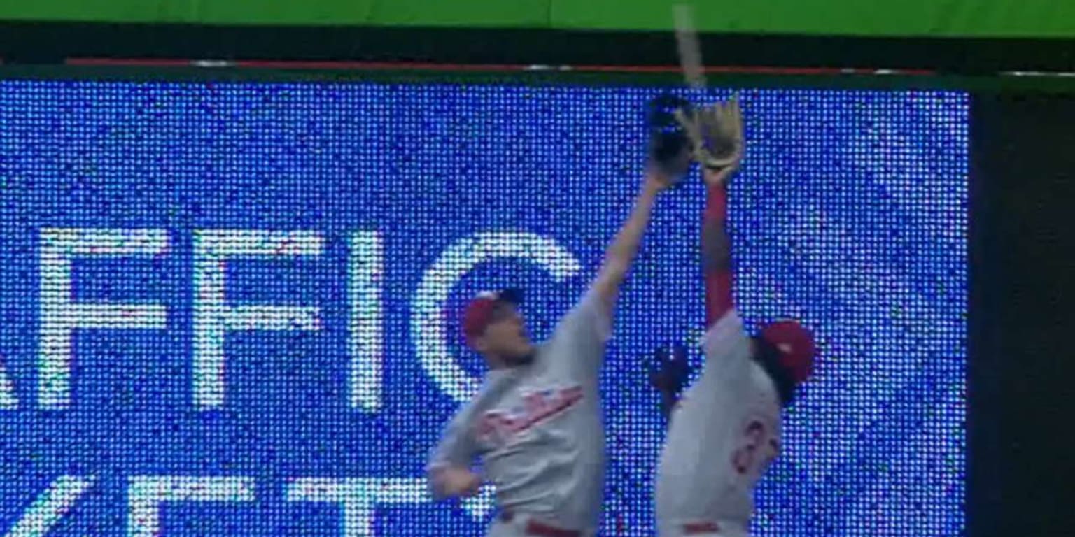 Cameron Perkins and Odubel Herrera jumped for a catch, Perkins caught ...