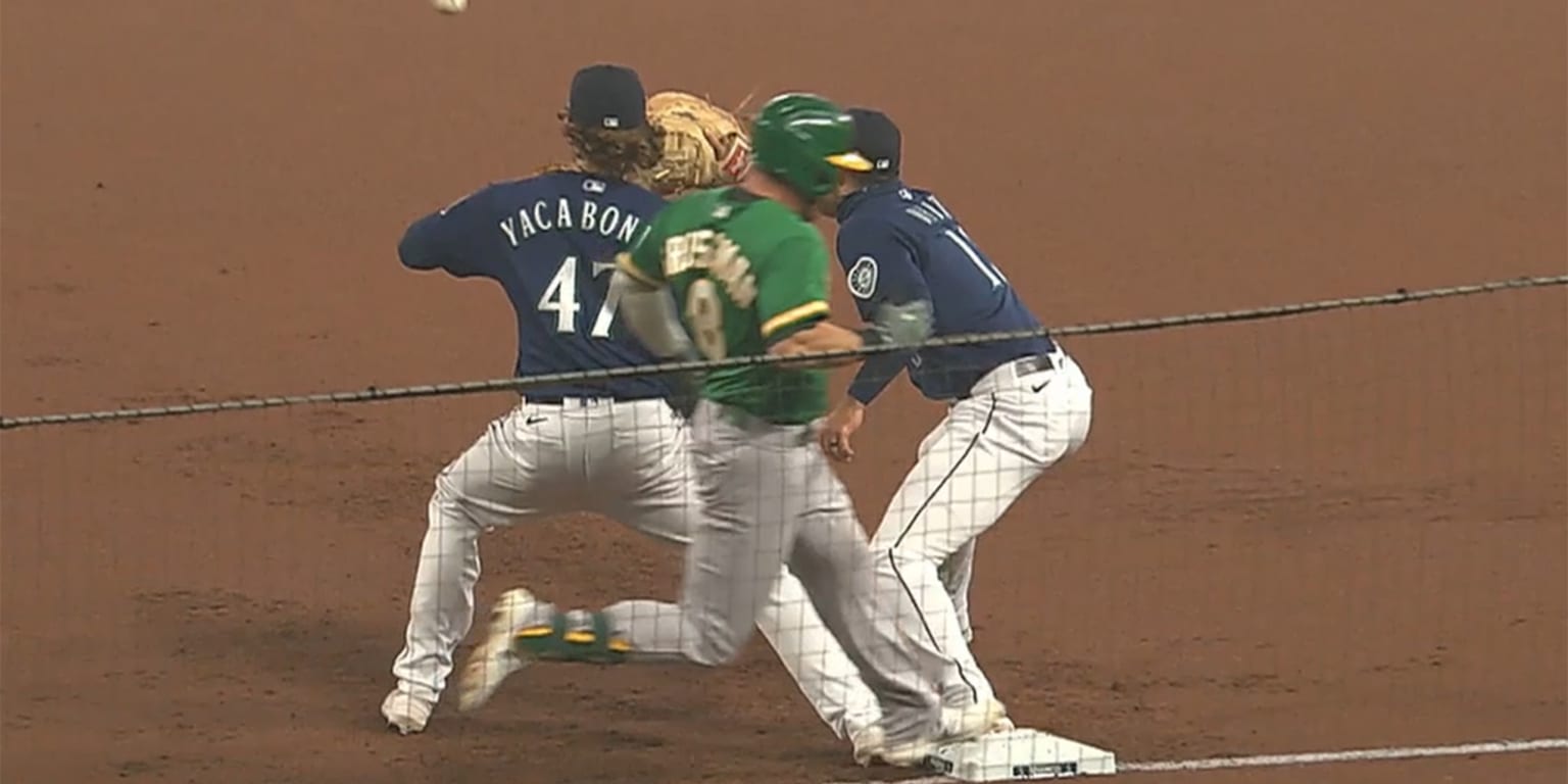 Multiple Mariners defending first base on play