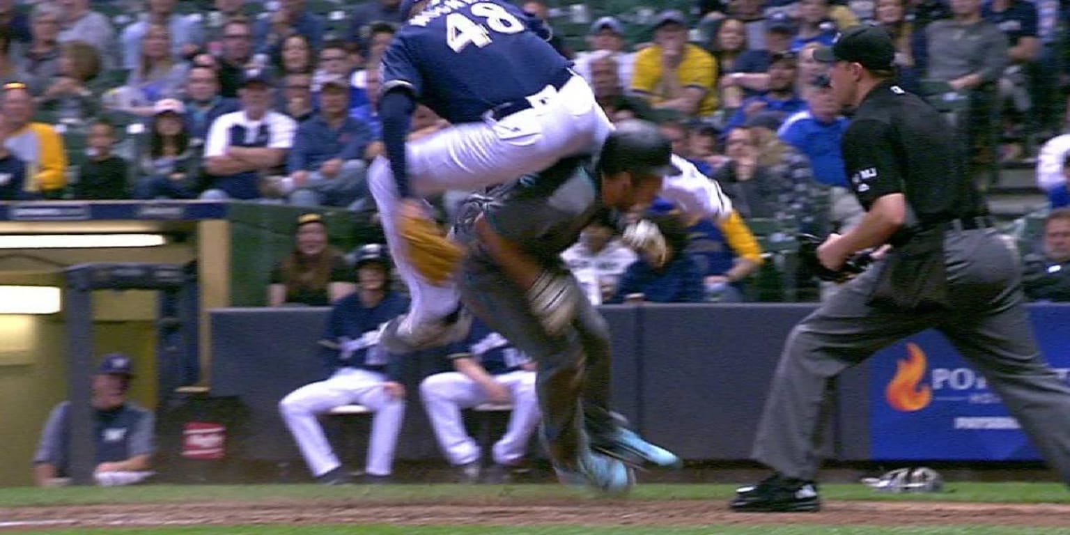 Trying to get out of the way of Paul Goldschmidt's slide, Jared Hughes ...