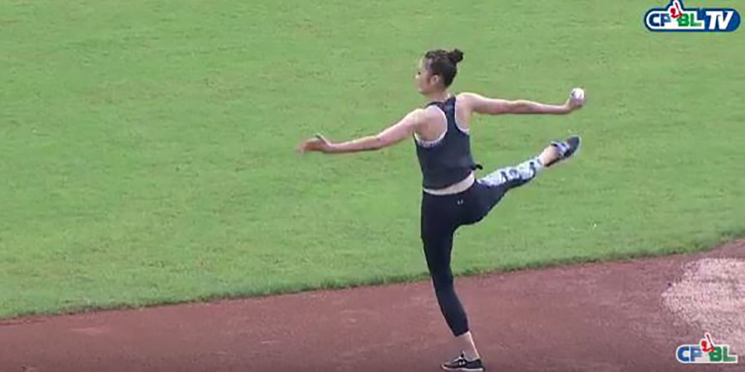 Watch a gold-medal gymnast throw out an amazingly acrobatic first pitch ...