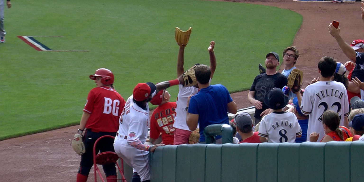 Reds outfielder makes catch between fans | MLB.com