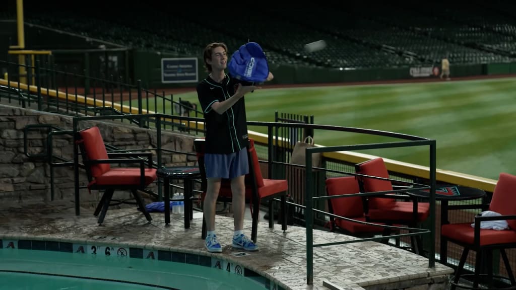 man catching baseball bat