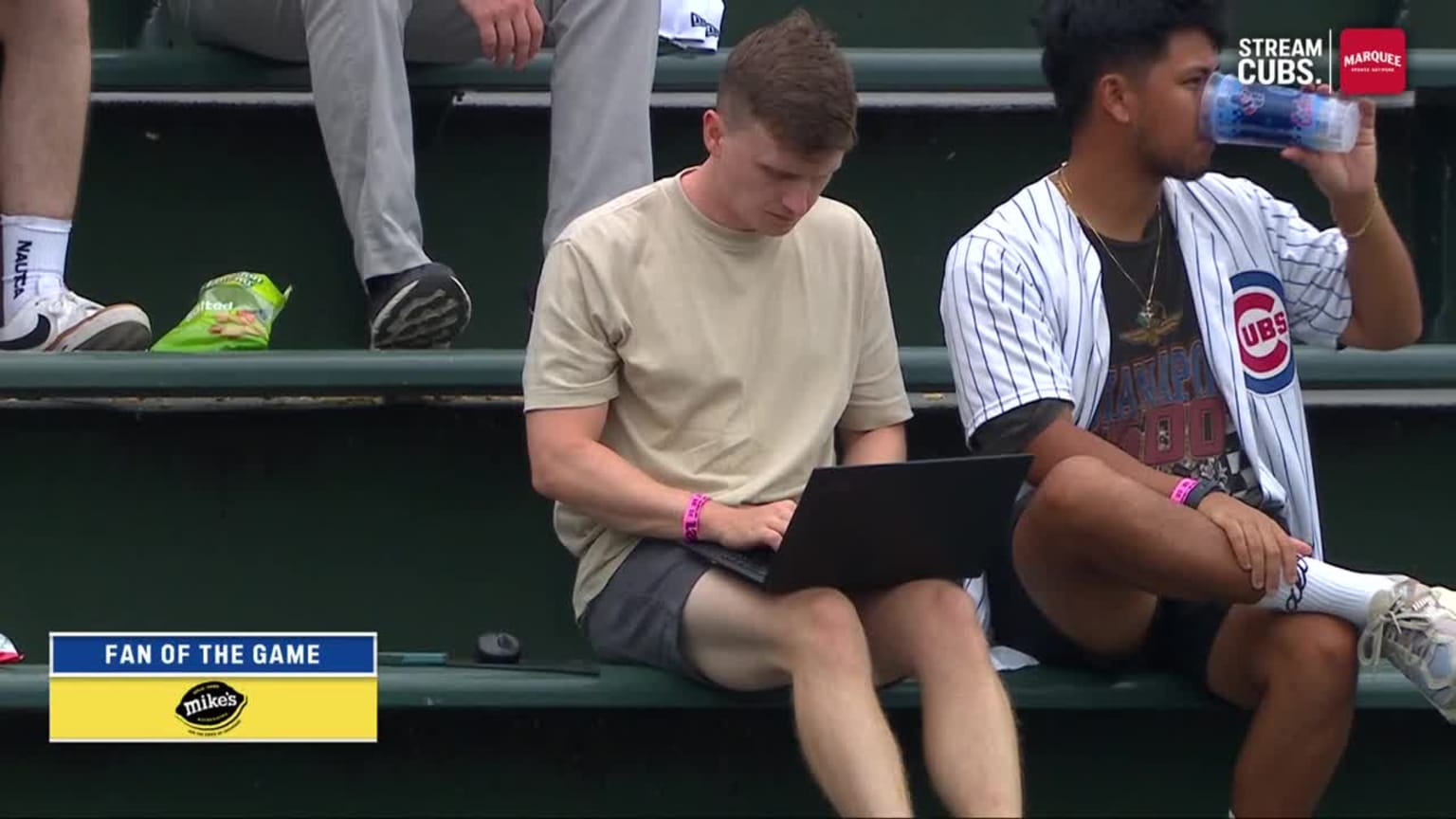 Fan uses his laptop during game at Wrigley Field | 08/19/2025 | Chicago ...