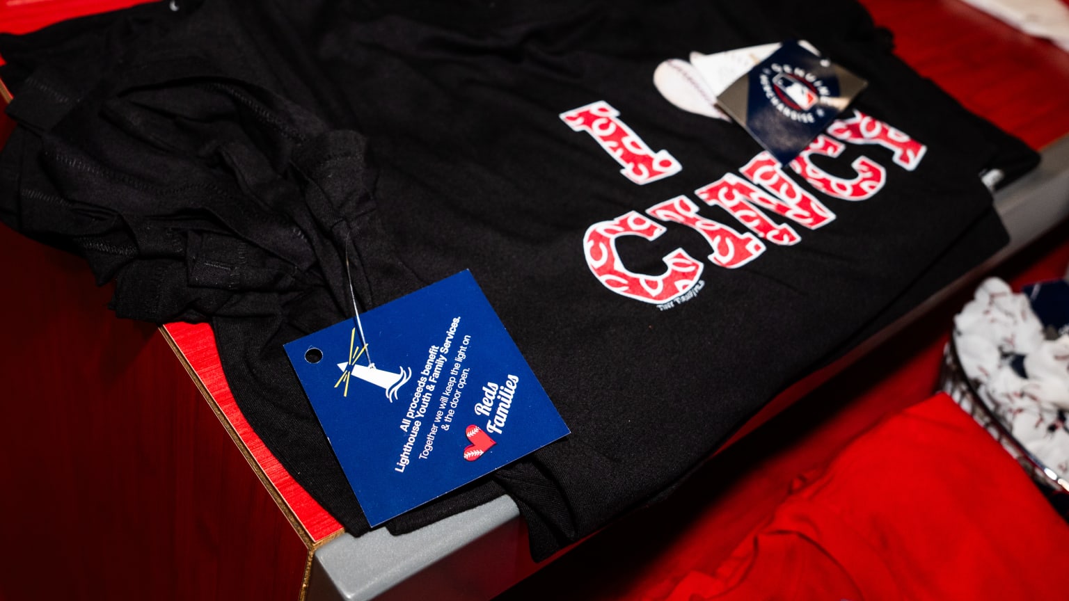 Reds' players, families give back through Shop the Cause