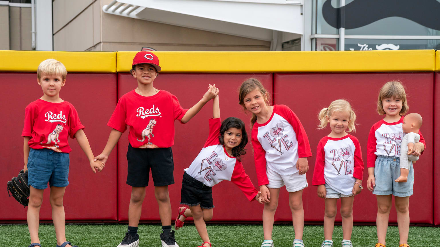 Reds' players, families give back through Shop the Cause