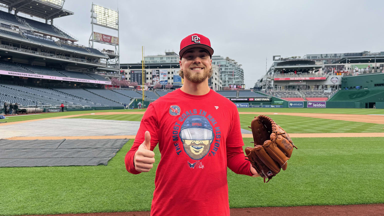 Jake Irvin celebrates Alex Ovechkin's NHL goal record