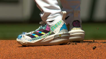 Bryan Woo wears cleats from young cancer patients