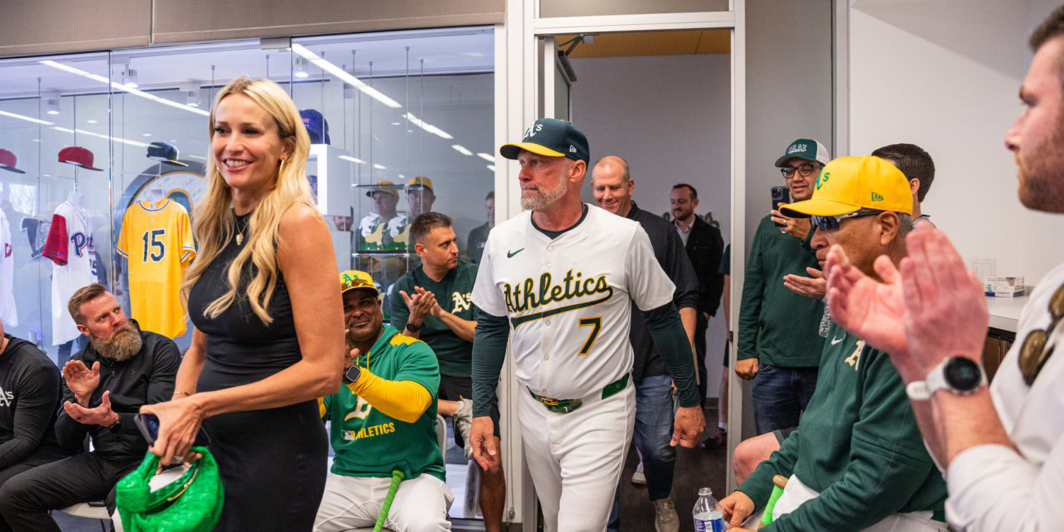 A's players celebrate Mark Kotsay after contract extension