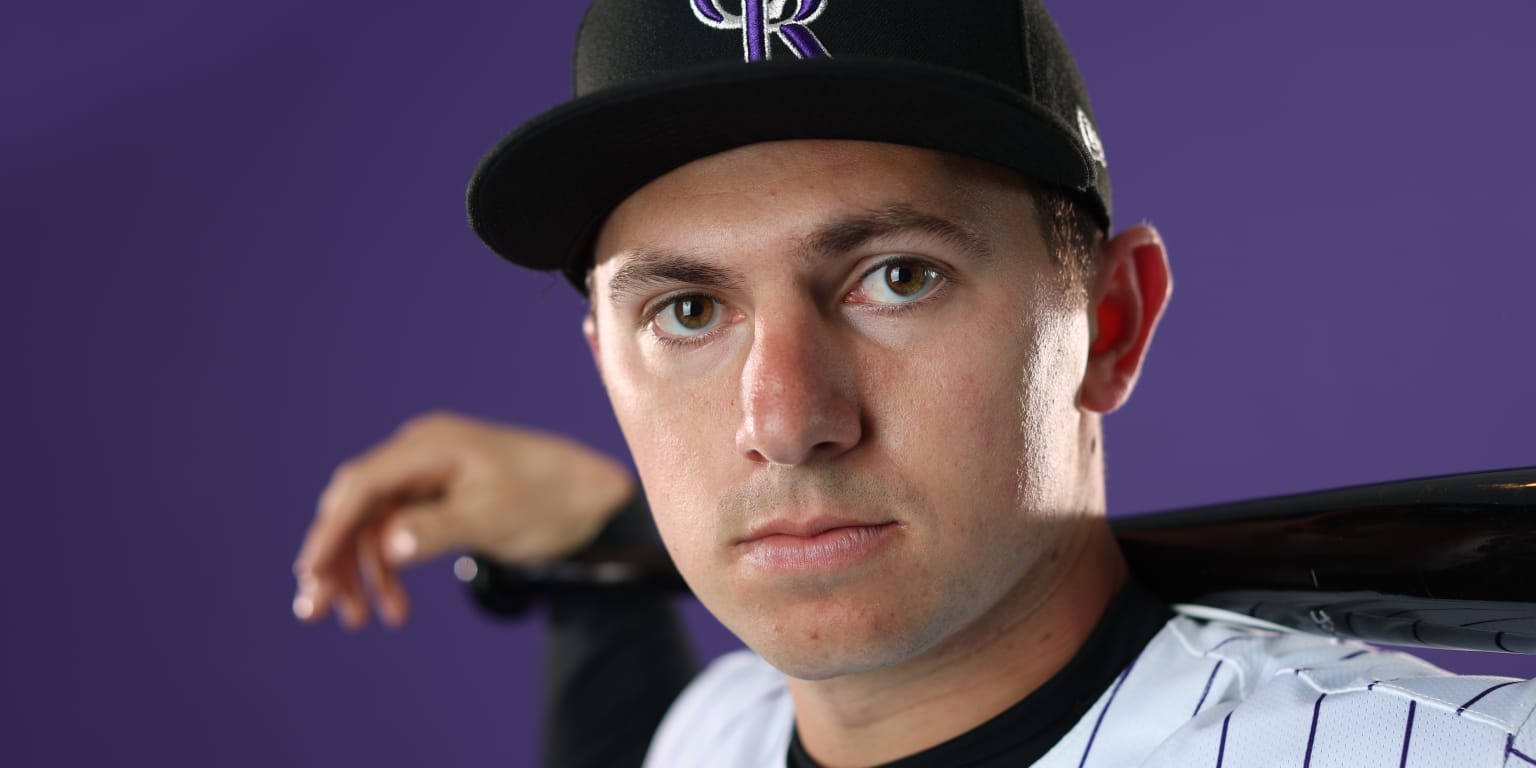 Drew Romo catches for Rockies after working on throws