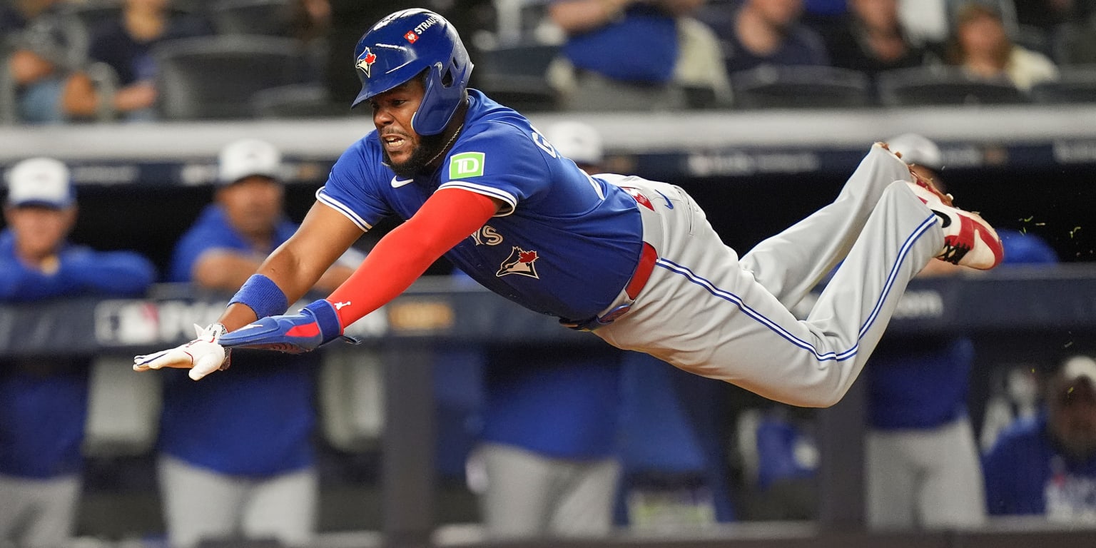No cape needed! Vlad soars for incredible head-first slide into home ...