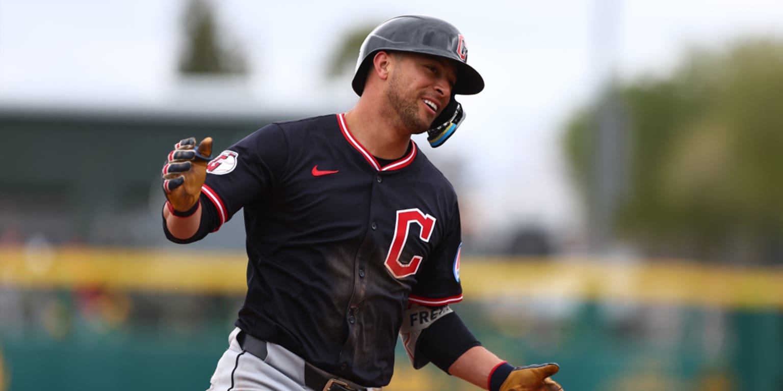 Tyler Freeman carries many gloves for Guardians