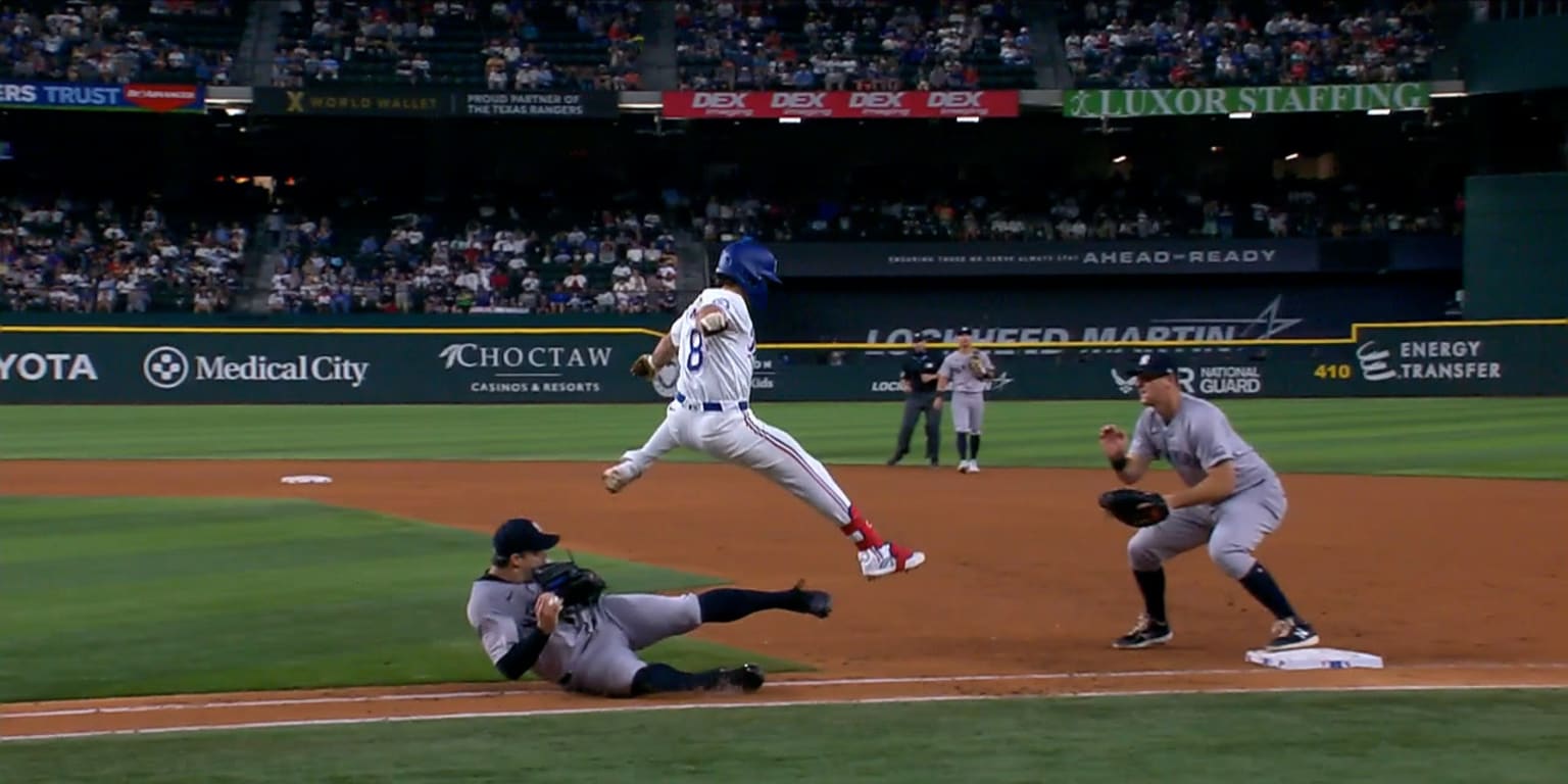 Josh Smith hurdles to make it safely to first base