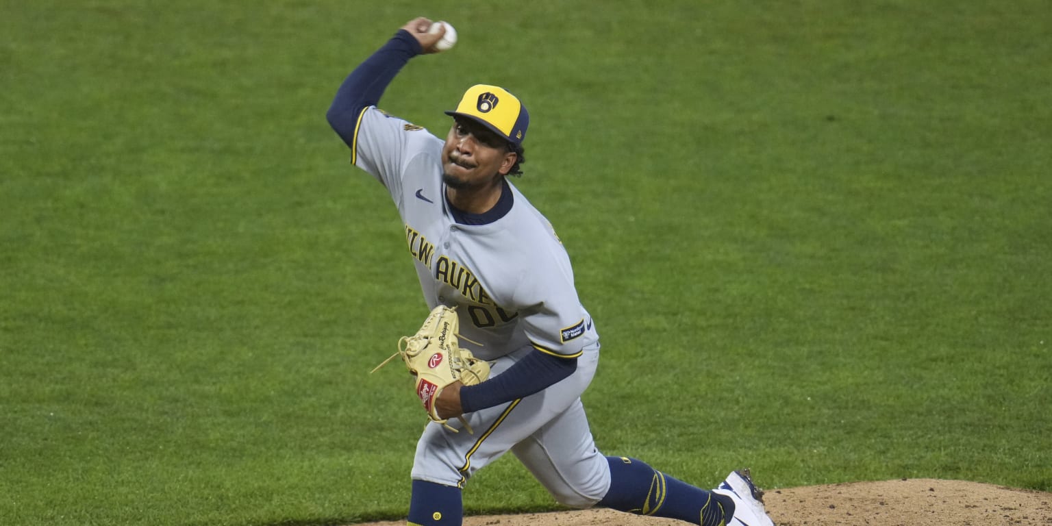 Carlos Rodriguez pitches through rain delay, earns first career win