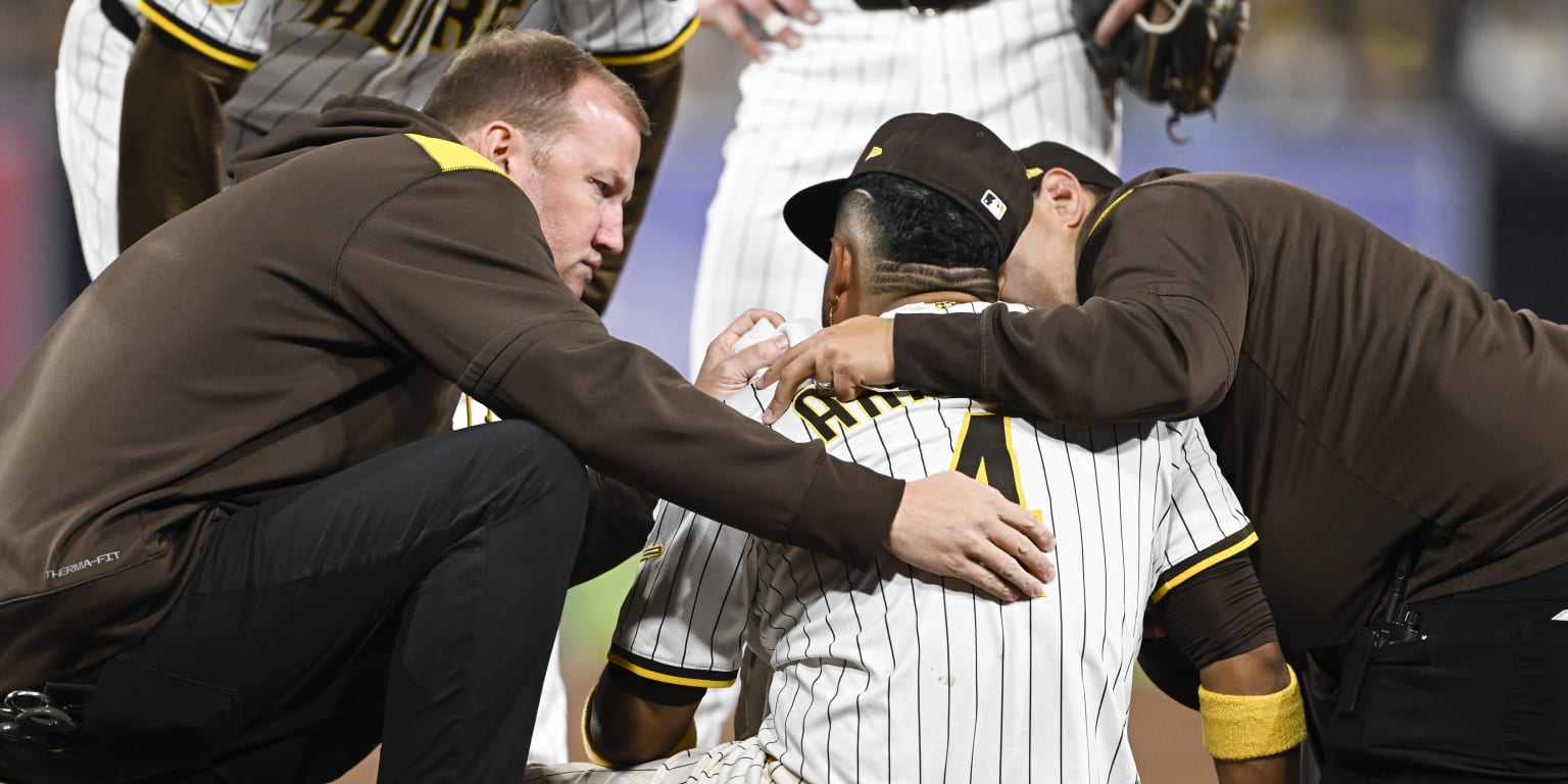 Luis Arraez exits after he's hit by errant warm-up throw