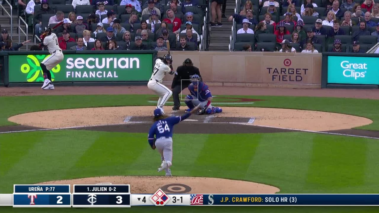 Edouard Julien singles on a line drive to left fielder Evan Carter ...